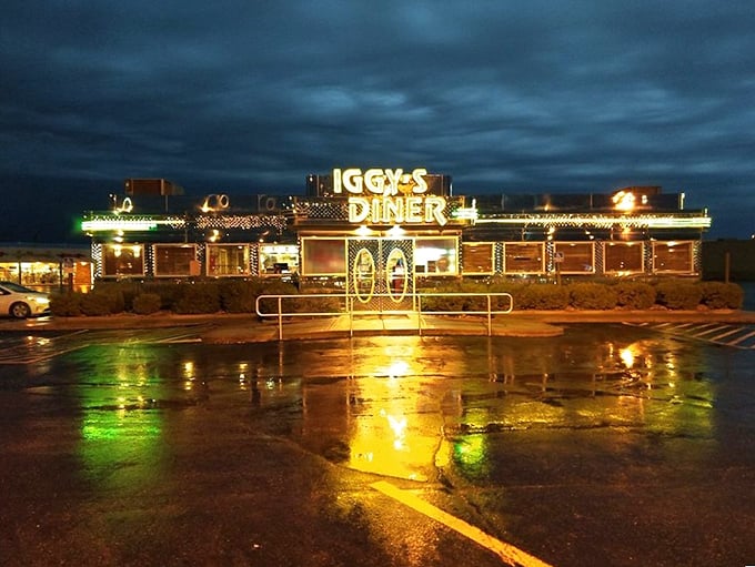 Iggy's Diner glows with neon promise against the night sky, a beacon for hungry travelers seeking comfort food with a side of nostalgia.