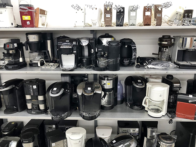Coffee makers lined up like caffeinated soldiers. Each one has brewed thousands of morning revivals and now awaits a new kitchen to serve.
