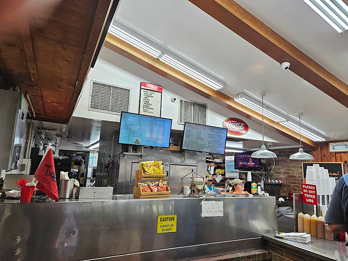 The command center where burger dreams become reality&mdash;stainless steel, practiced hands, and decades of know-how make it happen.