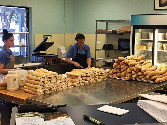 Behind the scenes, bakers transform simple ingredients into extraordinary loaves. This is where the magic happens, one Cuban bread at a time.