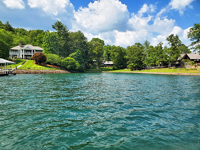 Lake Blue Ridge sparkles like liquid sapphire, its pristine waters reflecting the perfect blue Georgia sky. Vacation homes dot the shoreline like a real estate dream board.