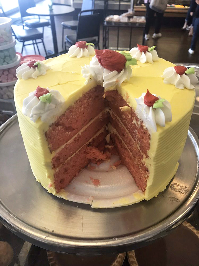 This strawberry lemon cake with its perfect slice removed is like seeing the cross-section of happiness itself.