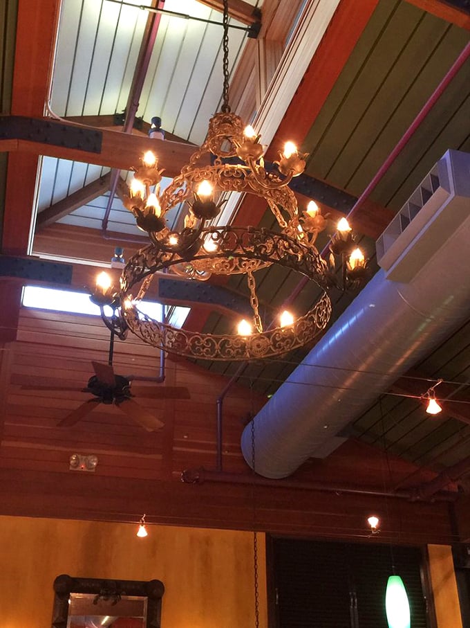 The ornate chandelier casts a warm glow that makes everyone look like they've just returned from a beach vacation with the perfect tan.