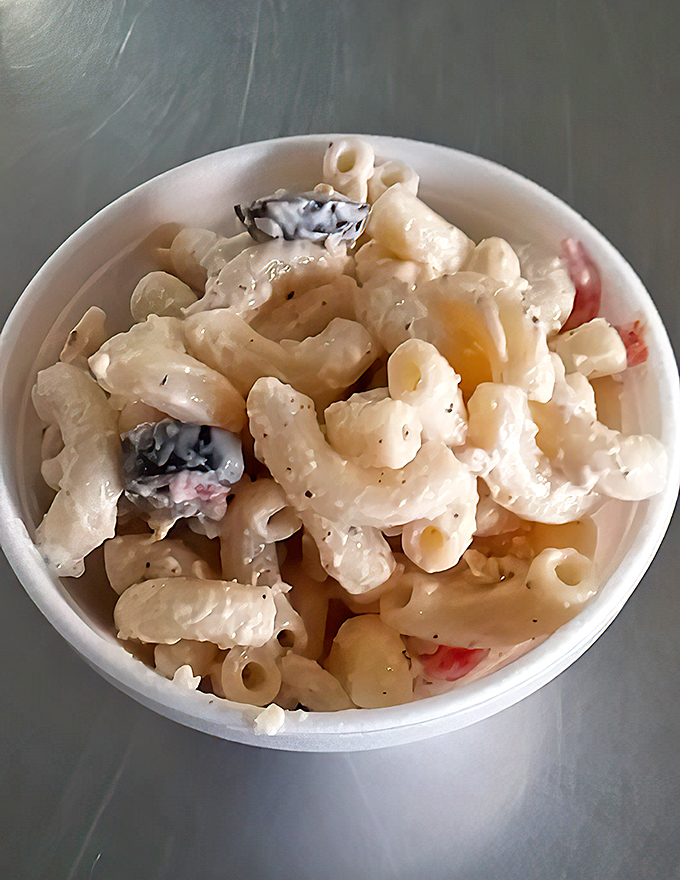This macaroni salad isn't messing around. Creamy, perfectly chilled, with just enough mystery ingredients to keep you coming back for "just one more bite."