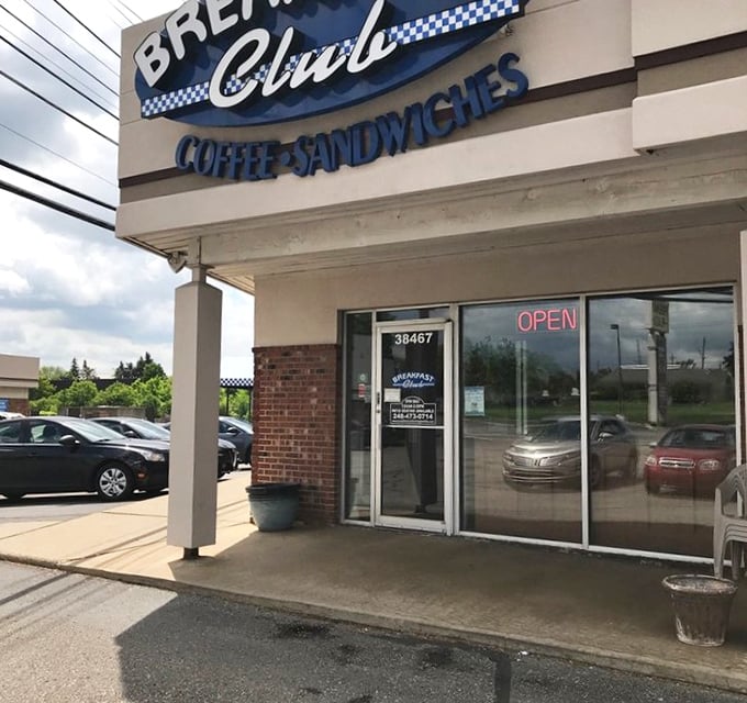 The blue and white checkered sign beckons like a breakfast lighthouse guiding hungry souls to safe harbor.