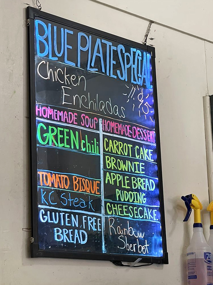 The menu board pops with neon enthusiasm, showcasing homemade desserts that your willpower doesn't stand a chance against&mdash;carrot cake and rainbow sherbet calling your name.
