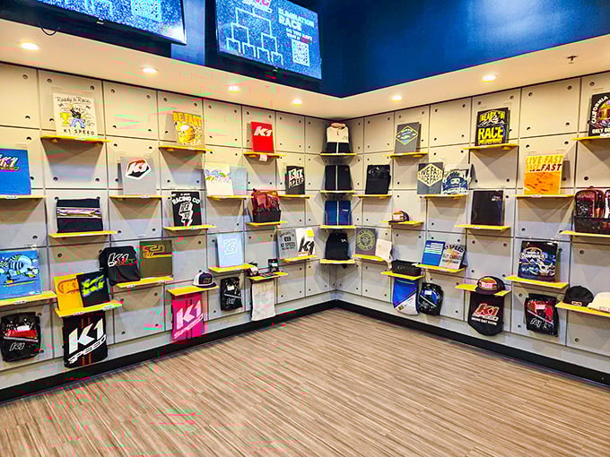 Racing fashion on display. The merchandise wall lets you take home a piece of the experience—or at least look the part of a serious kart enthusiast.