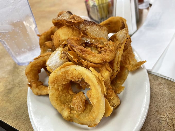 Onion rings stacked so perfectly they could double as Olympic rings for a very delicious opening ceremony.