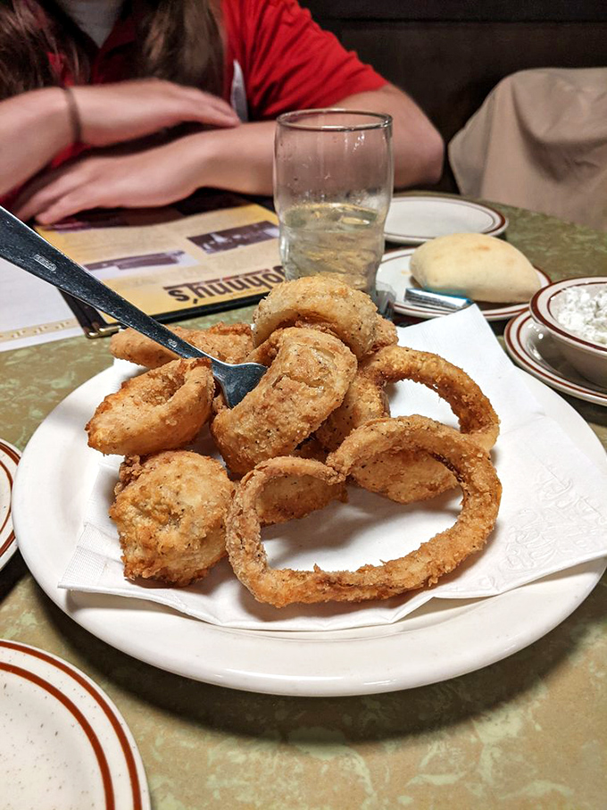 The onion rings at Johnny's aren't just side dishes&mdash;they're crispy golden halos that deserve their own place in the comfort food hall of fame.