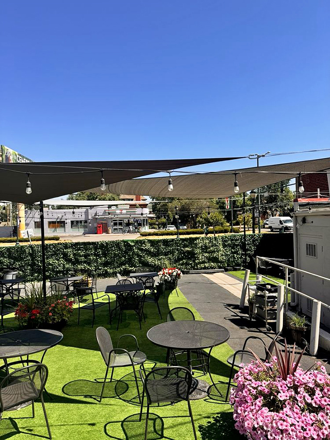 The secret garden of Pete's—where summer brunches unfold under Colorado's impossibly blue skies and string lights await evening's embrace.