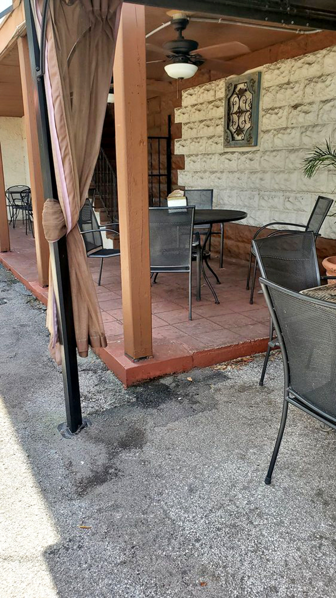 The outdoor seating area offers the quintessential Florida dining experience: sunshine, gentle breezes, and the promise of people-watching.