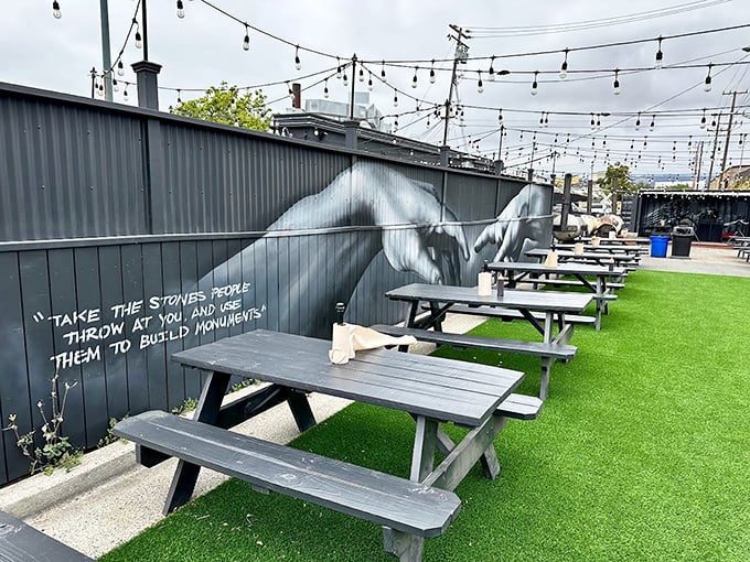 The outdoor seating area where string lights and inspirational quotes create the perfect backdrop for that post-brisket moment of pure contentment.