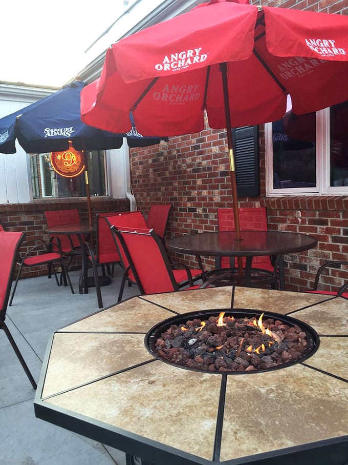 The outdoor patio with fire pit creates the perfect atmosphere for contemplating life's big questions, like "How did I just eat that entire burger?"