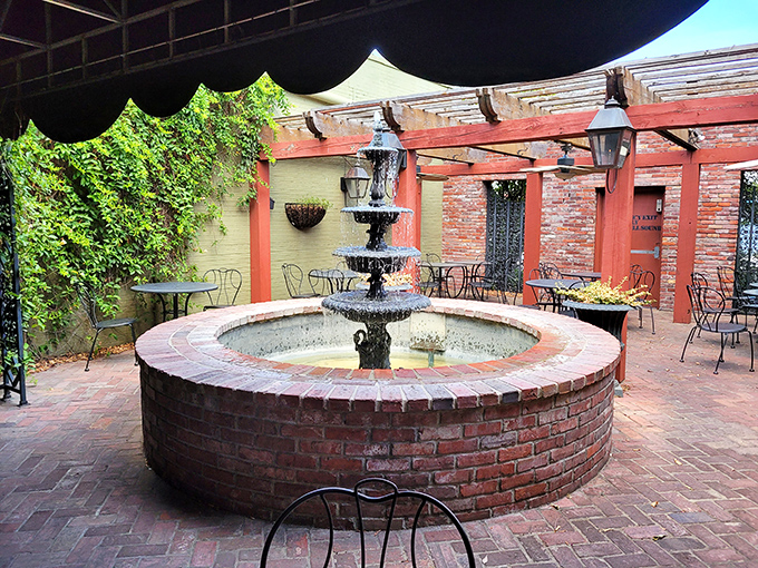 A bubbling fountain centers the brick courtyard, creating a Mediterranean-inspired oasis in the heart of Conway.