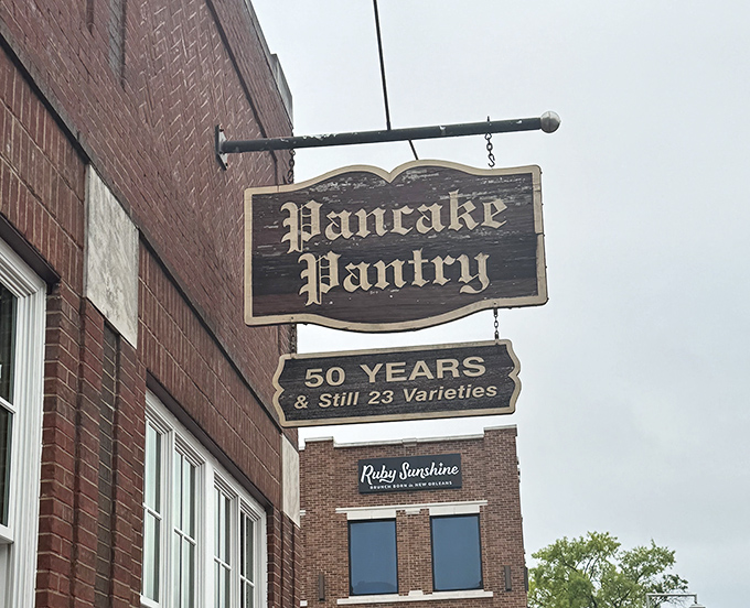 The weathered wooden sign has pointed the way to pancake paradise for generations, promising the same 23 varieties that have stood the test of time.