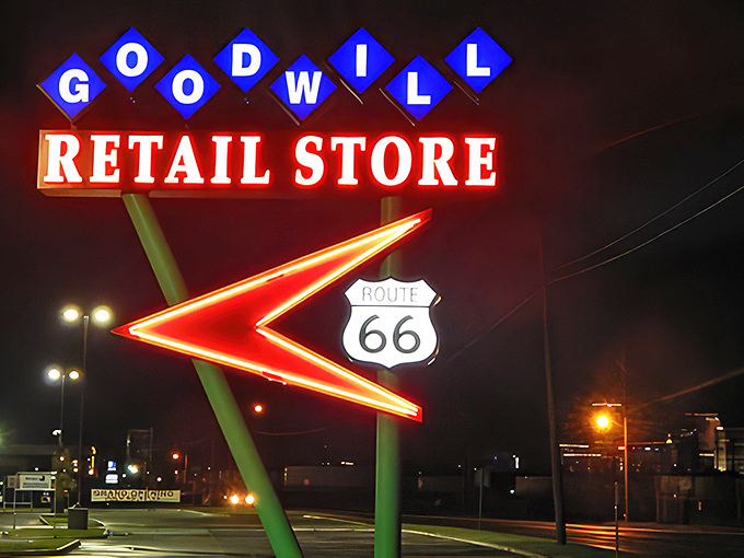 After dark, the vintage-style neon sign glows like a Route 66 landmark, guiding night owls to late-evening bargain opportunities.
