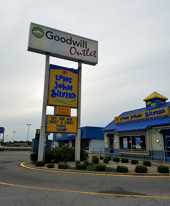 The sign shares space with Long John Silver's—because hunting for vintage treasures works up an appetite for something breaded and fried.
