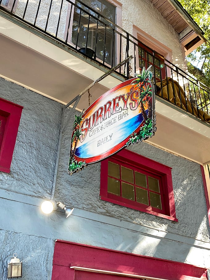 Surrey's sign swinging in the New Orleans breeze &ndash; not just a caf&eacute; name, but a promise of breakfast greatness awaiting inside.