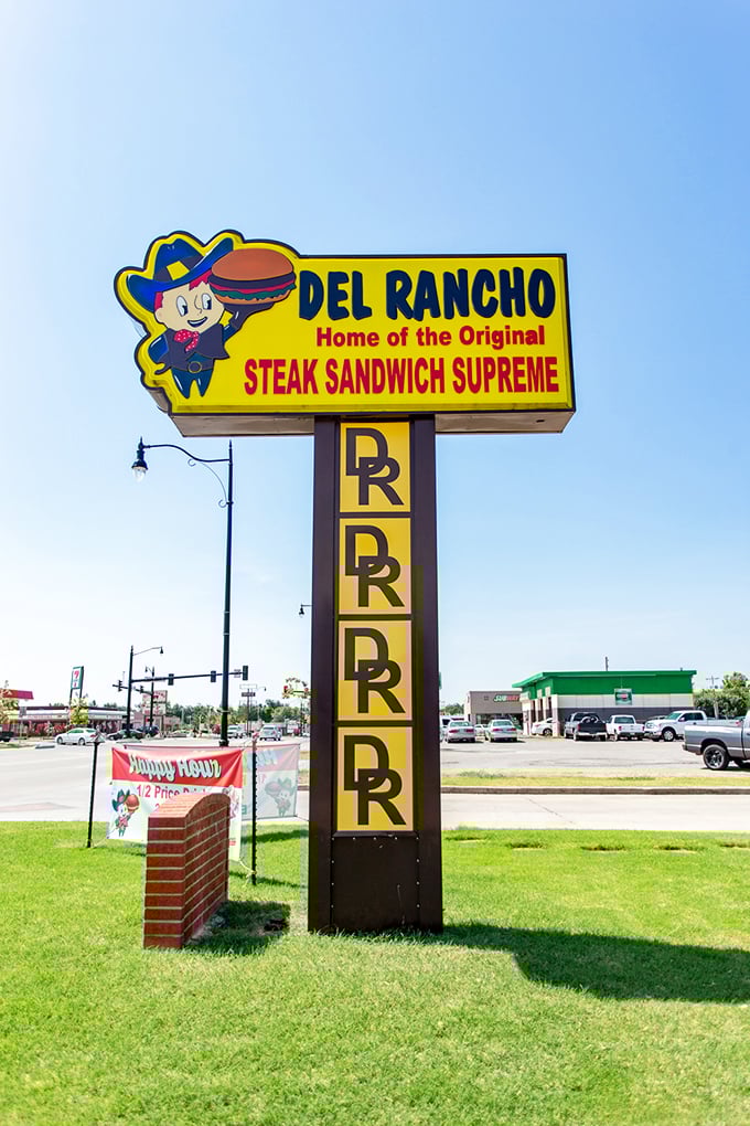 The cartoon cowboy has watched over generations of hungry Oklahomans, a yellow beacon promising "Steak Sandwich Supreme" salvation ahead.