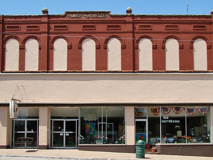 The Palmer and Smelser building's classic storefront has witnessed generations of Perry shoppers, its upper fa&ccedil;ade a masterclass in brick craftsmanship.