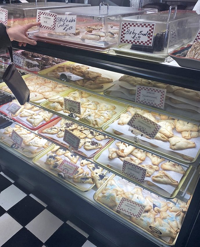 Pastry paradise alert! This display case is like Willy Wonka's factory for grown-ups who prefer rugelach over chocolate rivers.