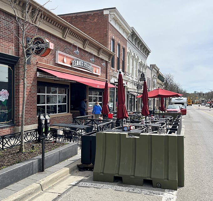The outdoor seating area along Milford's historic Main Street offers the perfect stage for enjoying barbecue while watching small-town Michigan unfold.