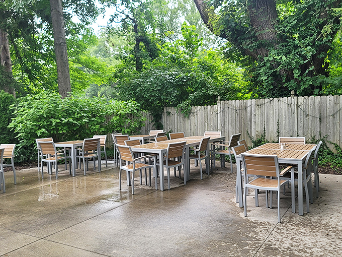 The patio at Hollyhock Hill offers al fresco dining surrounded by greenery. Nature and fried chicken—a pairing as old as Indiana itself.