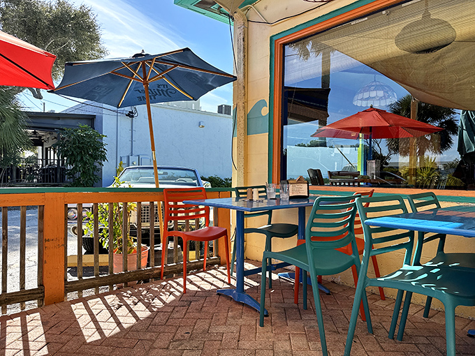The patio offers colorful seating, dappled sunshine, and the perfect setting for that post-beach meal when you're sandy but starving.