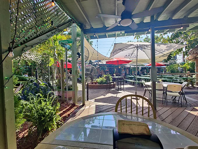 The patio offers a sun-dappled escape where Florida's natural beauty mingles with the scent of burgers and the promise of unhurried conversation.