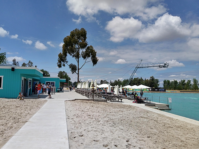 Picnic tables and sandy shores create the perfect viewing area for parents to simultaneously relax and maintain the illusion they can still rescue their children if needed.