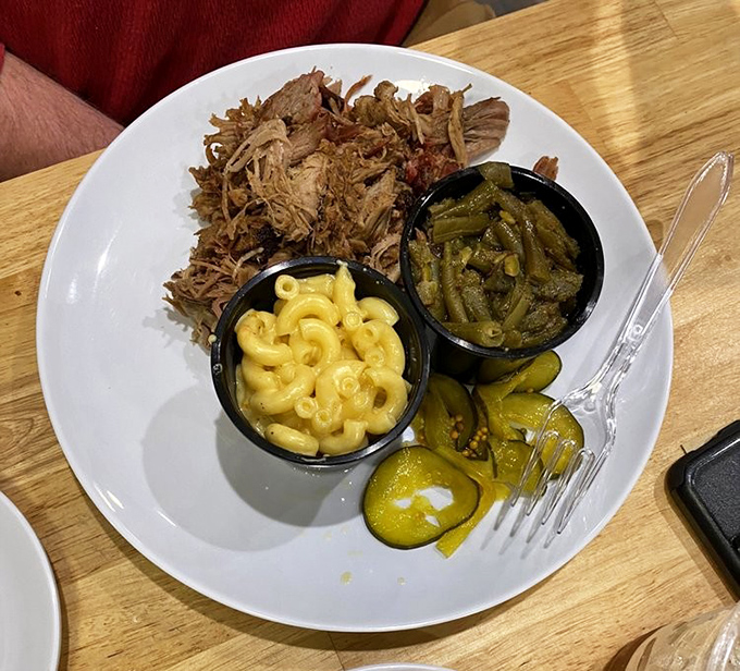 A plate that speaks the universal language of comfort: pulled pork with mac and cheese and green beans&mdash;the holy trinity of Southern-inspired satisfaction.