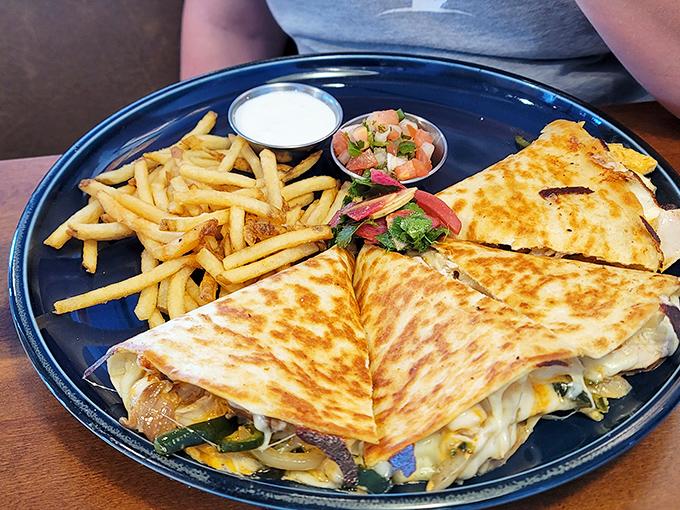This quesadilla isn't messing around&mdash;golden-brown, stuffed with promise, and flanked by fries that clearly didn't come from a freezer bag.