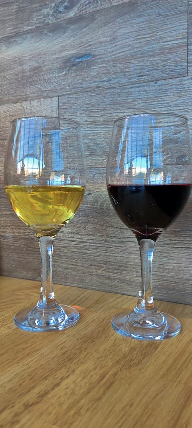 Two glasses that represent life's essential choice: do you want the crimson courage or the golden wisdom? The correct answer is "both."