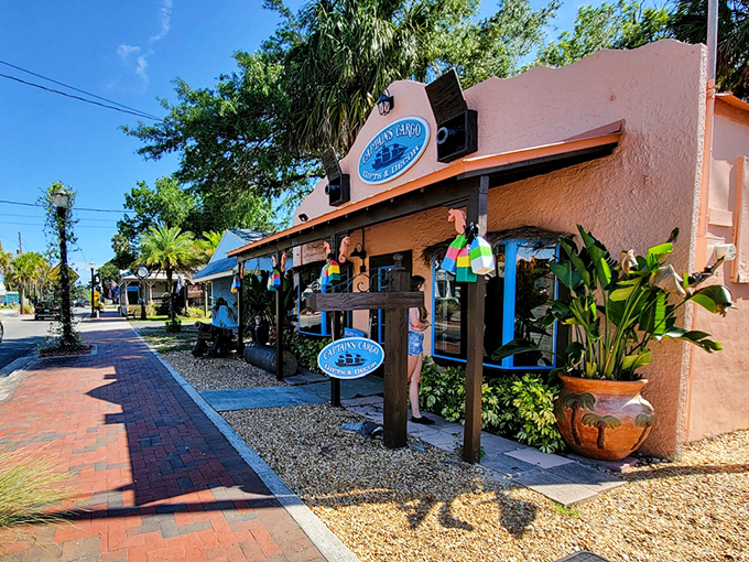 Colorful shops line Crystal River's main drag, where coastal-themed storefronts beckon with treasures. The Tea House Caf&eacute; sign promises refreshment after a day of manatee-watching.