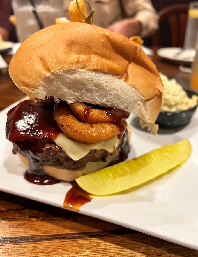 This isn't just a burger&mdash;it's a towering achievement of beef, cheese, and onion rings that requires both hands, several napkins, and zero regrets.