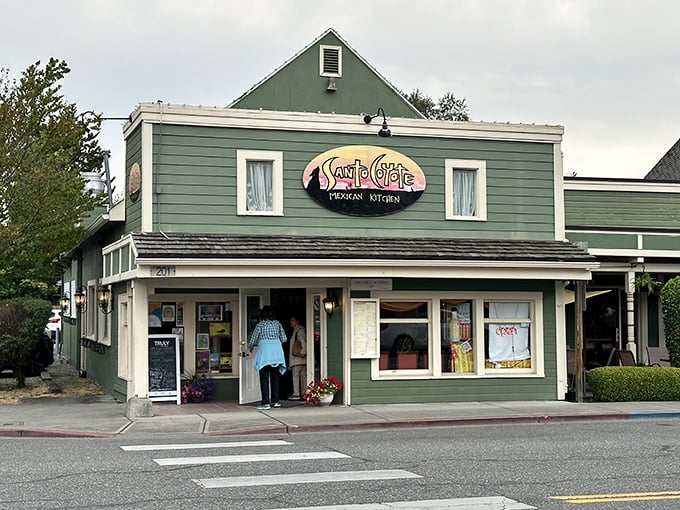 Santo Coyote Mexican Kitchen beckons hungry travelers with its cheerful green facade and promises of salsa-laden happiness inside.