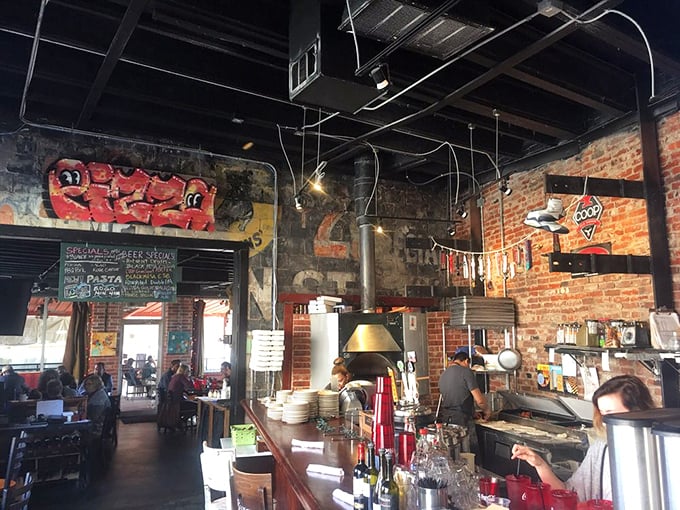 Organized chaos in the best possible way. The open kitchen layout lets you witness the choreographed dance of pizza-making from dough to delivery.