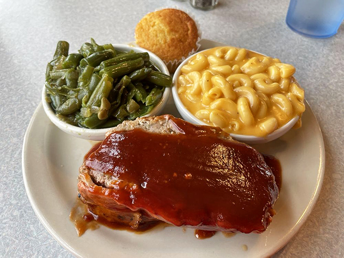 Meatloaf glazed with tangy sauce alongside mac and cheese that could make a grown person weep with nostalgic joy.