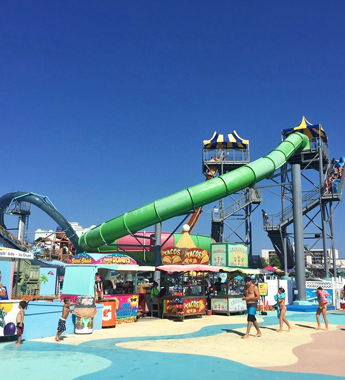 The snack stands offer that perfect combination of foods that somehow taste better when you're dripping wet and slightly sunburned.