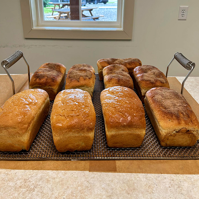 Sourdough loaves cooling on the rack&mdash;the bread equivalent of that perfect pillow you can't wait to rest your head on.