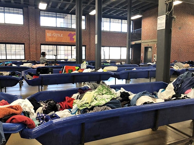 The warehouse's industrial charm creates the perfect backdrop for serious thrifting. High ceilings and exposed brick add unexpected elegance to bargain hunting.