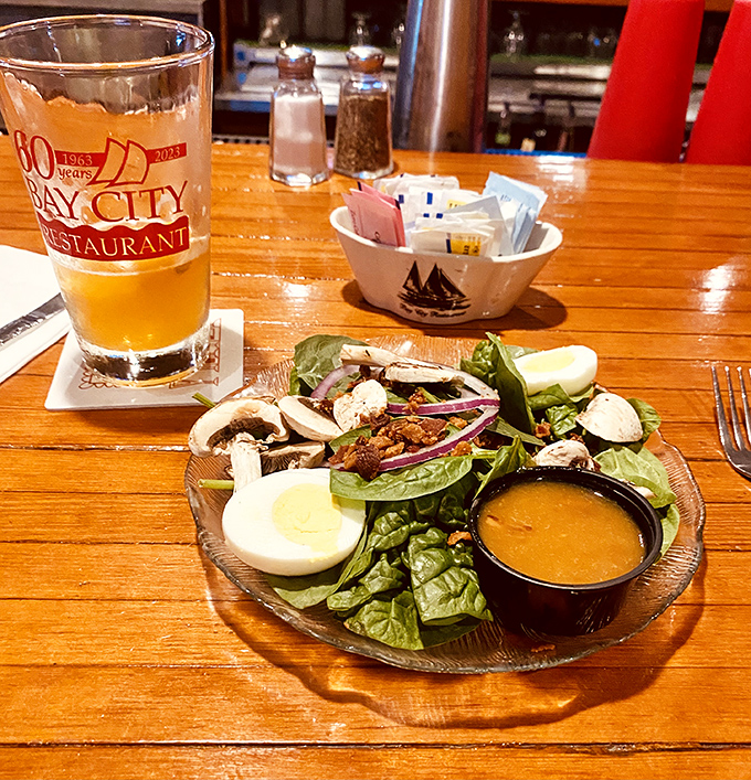 Even the salad gets the royal treatment&mdash;crisp greens, hard-boiled egg, and dressing that would make a vegetarian feel less martyred.