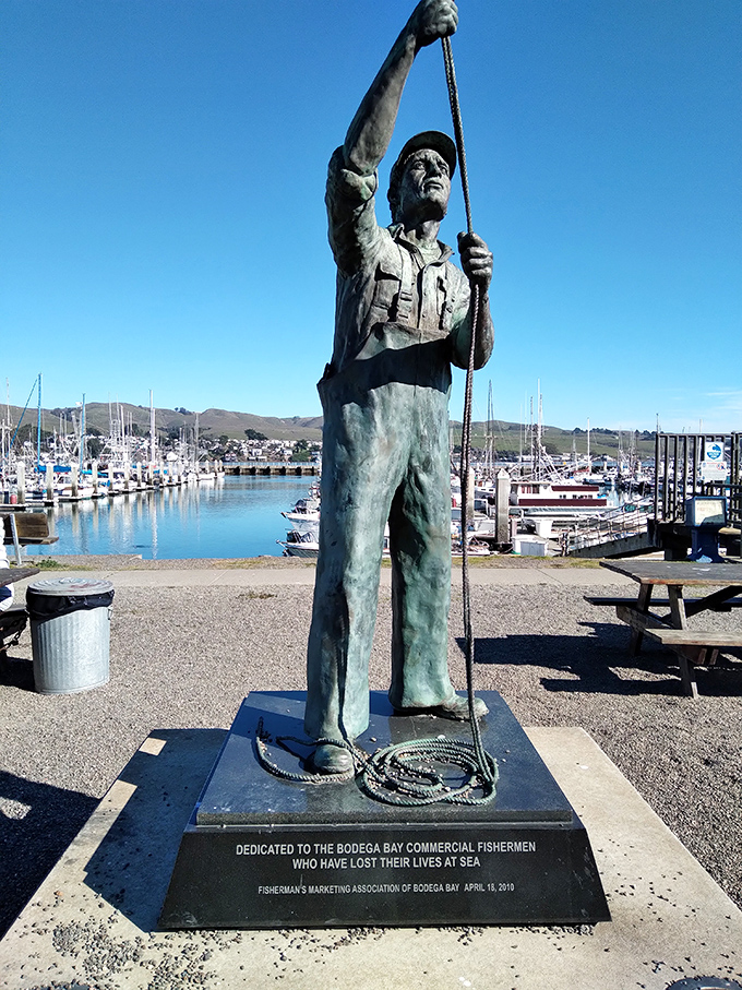 A solemn fisherman cast in bronze stands eternal watch over Spud Point Marina&mdash;a powerful reminder of the real heroes behind your seafood platter.