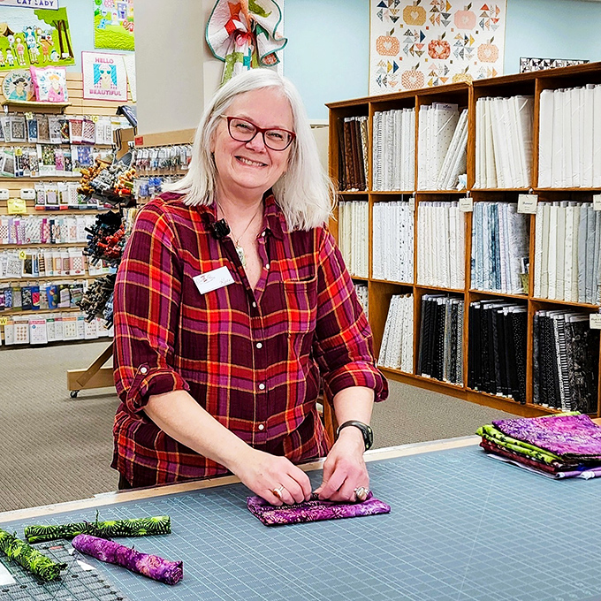 Fabric whisperers at work&mdash;where staff members transform intimidating yards of potential into manageable projects with a smile and steady hands.