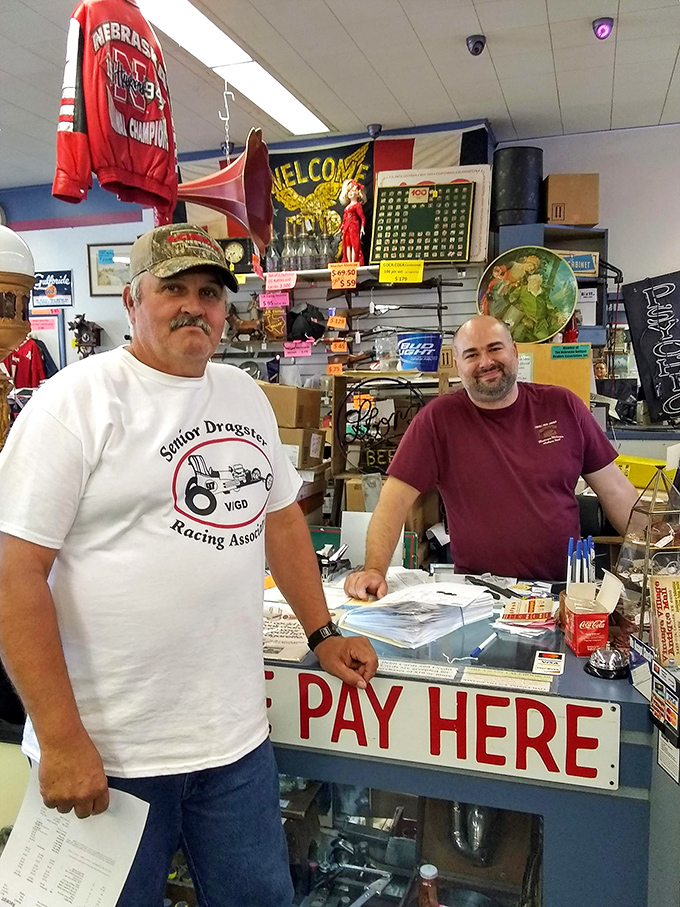 The guardians of history standing at the "PAY HERE" counter&mdash;these folks know the story behind every treasure in the building.