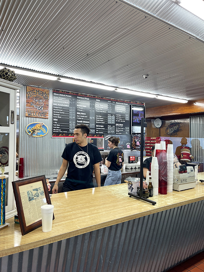 The counter staff at Biemer's&mdash;the gatekeepers to smoked meat paradise. Their t-shirts may be black, but their BBQ intentions are pure gold.
