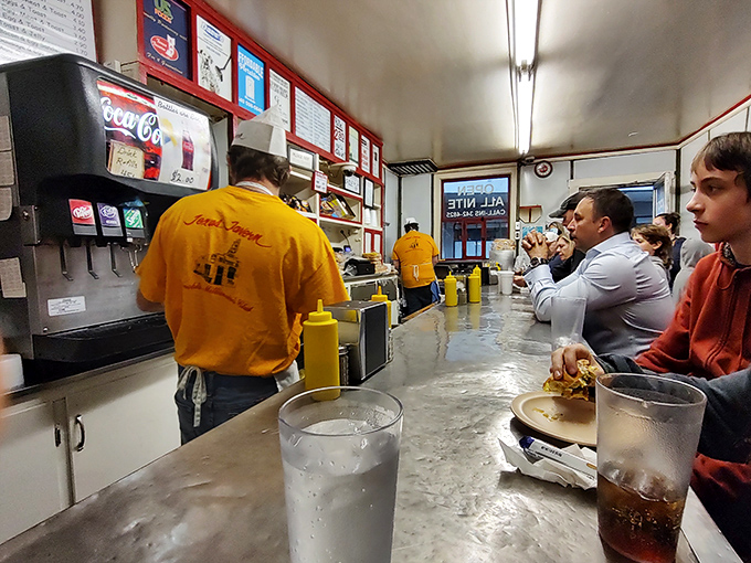 The yellow-shirted maestros of the grill orchestrate breakfast symphonies while customers watch in anticipation&mdash;this is short-order cooking as performance art.