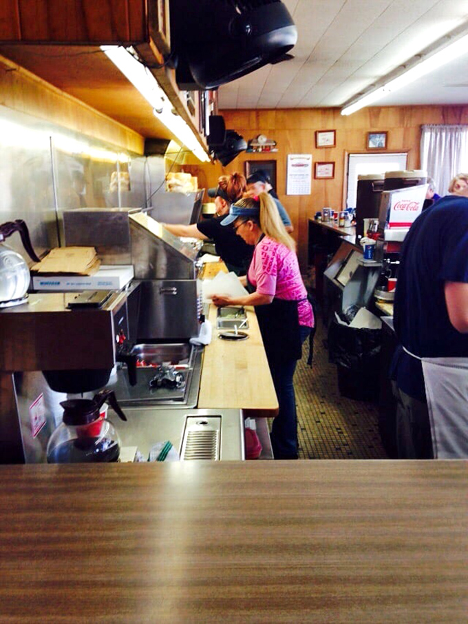 The crew moves with practiced precision, like a burger ballet company that's been performing the same cherished production for decades.