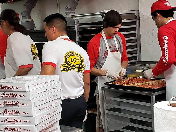 The pizza artisans of Frankie's, working with the focus of brain surgeons and the passion of artists. No tweezers or foam in sight.