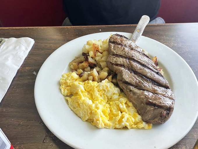 The triumvirate of breakfast satisfaction &ndash; perfectly grilled steak, fluffy scrambled eggs, and crispy potatoes. No further questions, Your Honor.
